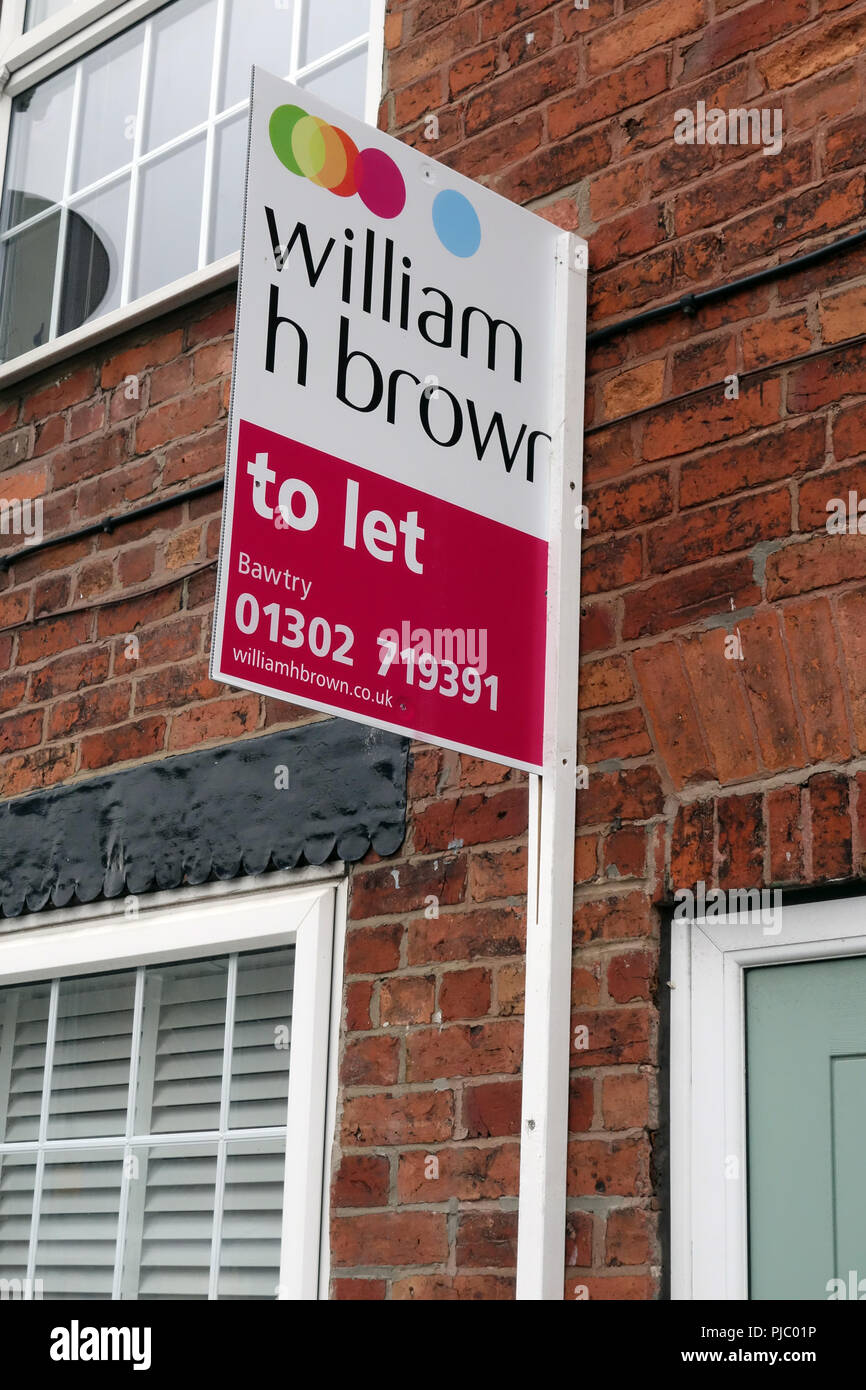 Cottage To Let sign fastened to house in Bawtry Stock Photo - Alamy