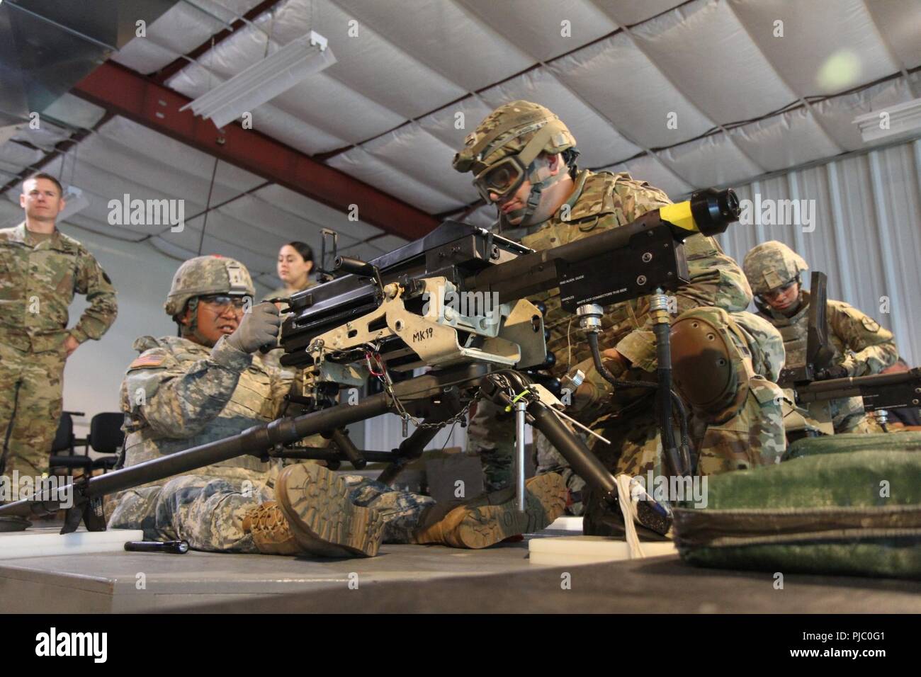 U.S. Army Reserve Spc. Gener Baysa, gunner, and assistant gunner, Staff ...