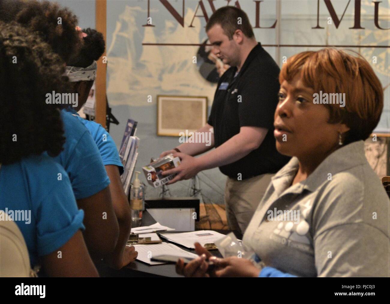 Sharon Houston (foreground) corrals middle school campers with the ...