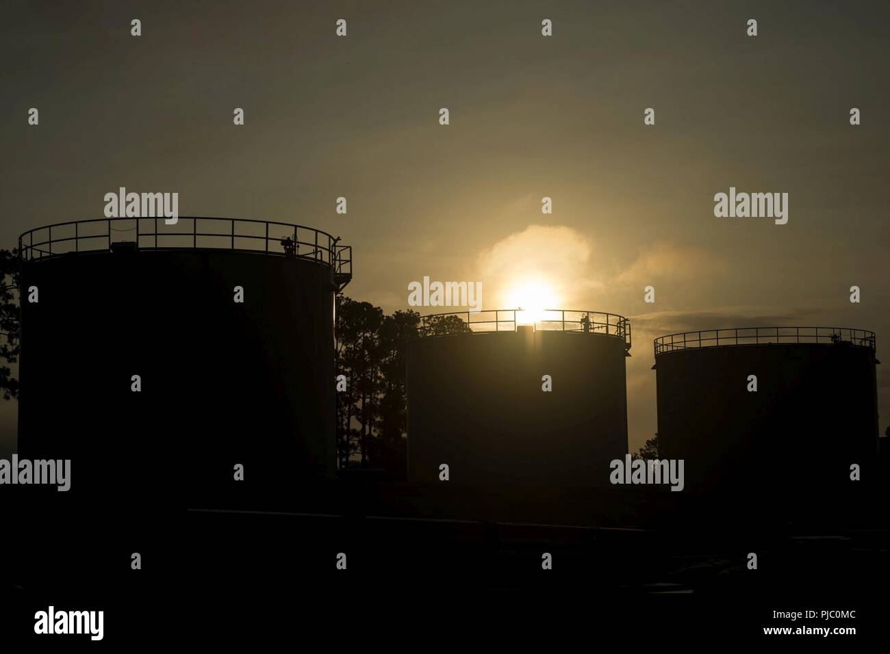 Above-ground jet fuel storage tanks rest in the 23d Logistics Readiness ...