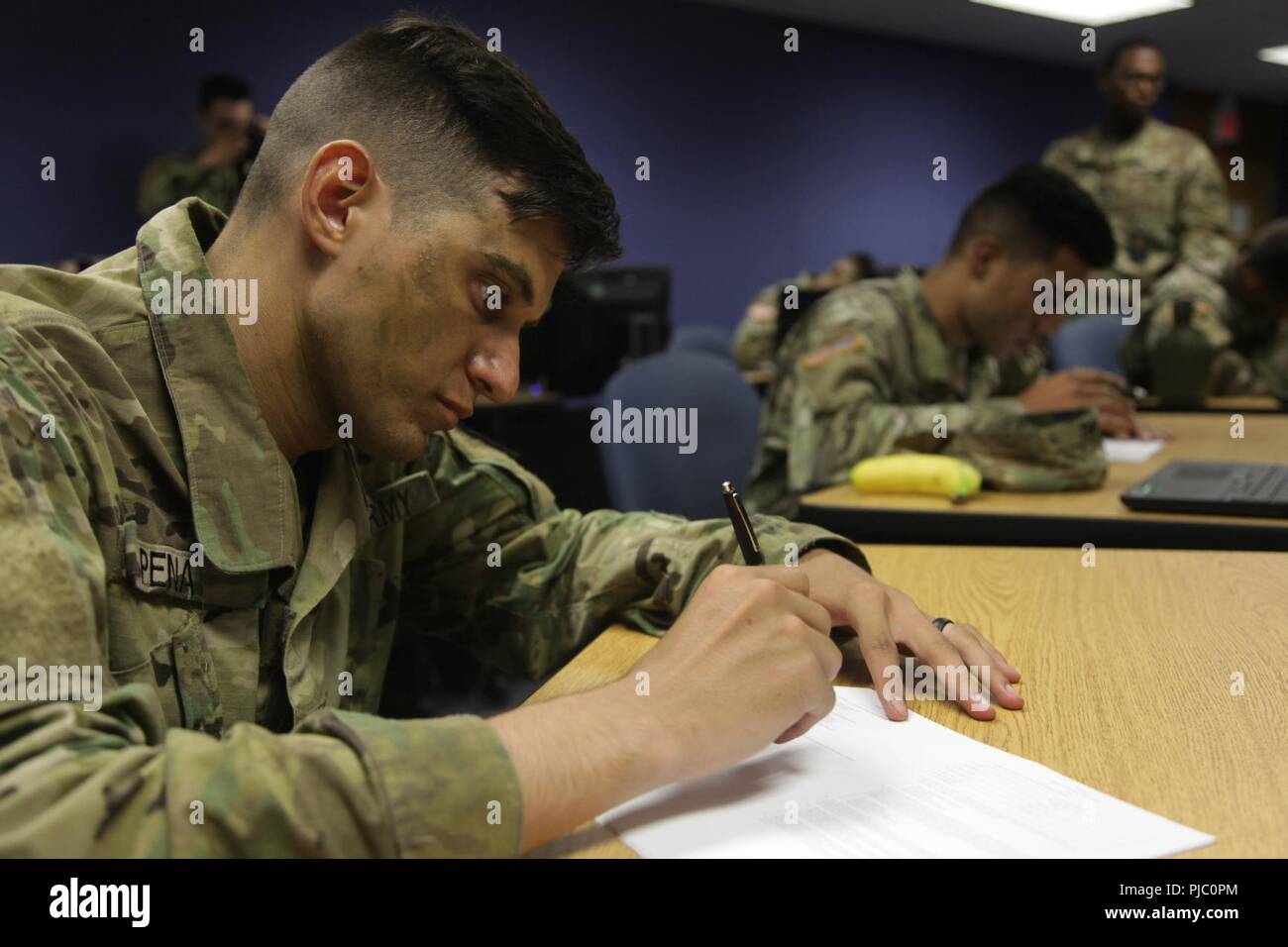 U.S. Army Soldiers from various units take the written exam portion of ...