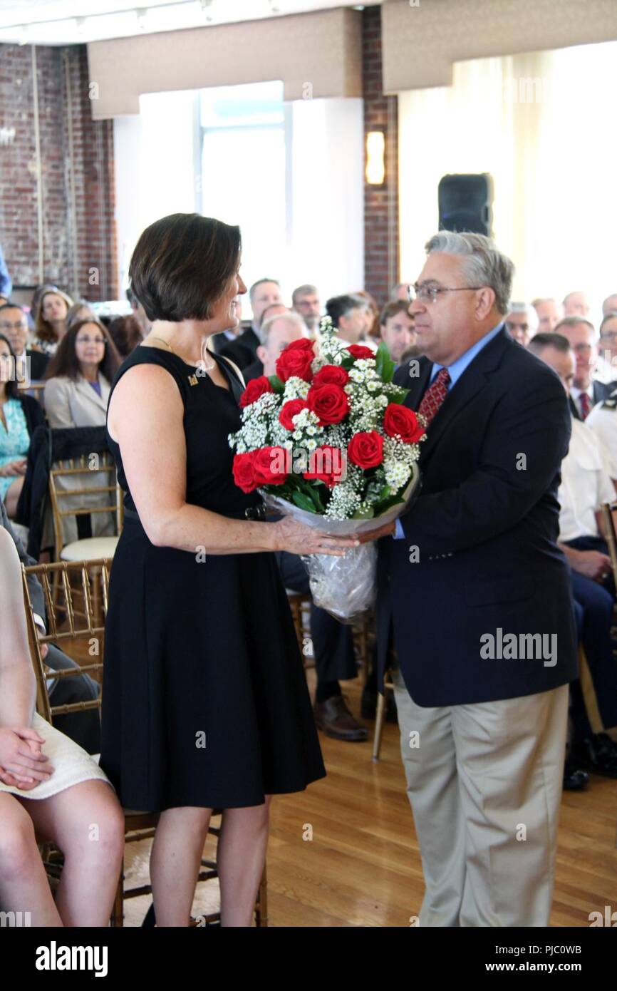 Civilian engineer Ralph Lamoglia presents Janet Graham, wife of out ...