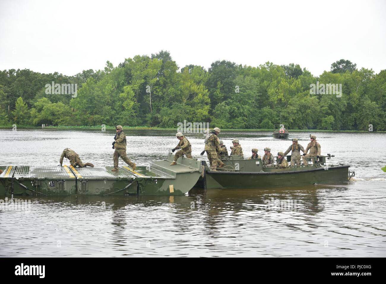 Soldiers of the 489th Engineer Battalion conduct wet gap crossing ...