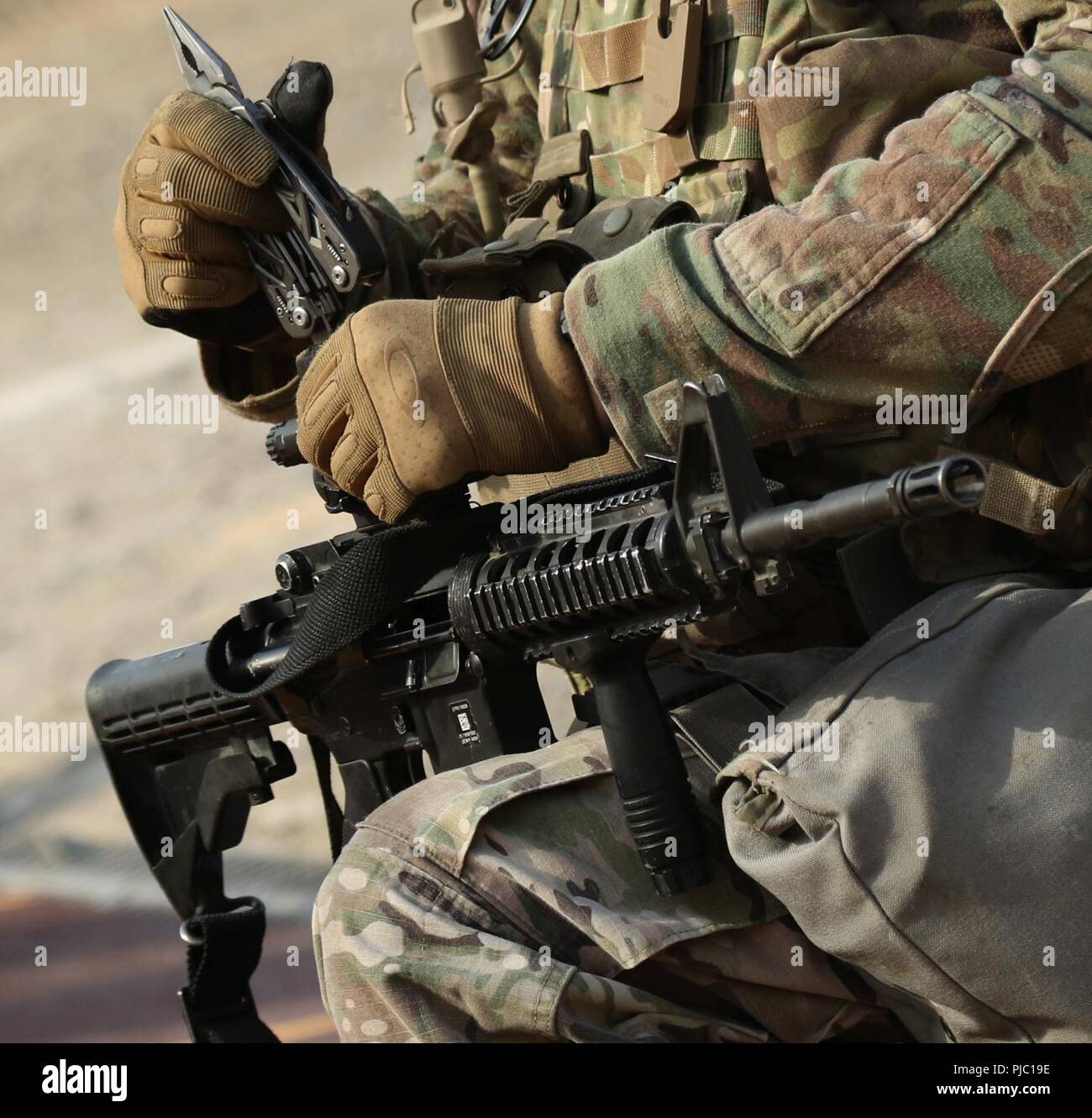 SOUTHWEST ASIA – Utilizing his Gerber tool, a Soldier from Bravo ...