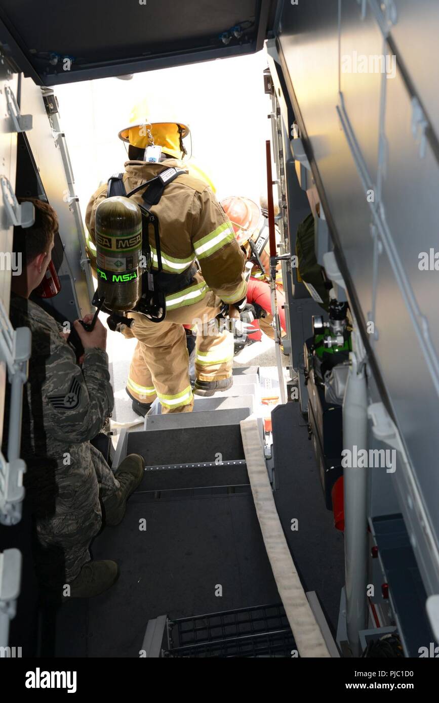 U.S. Airmen, assigned to the 424th Air Base Squadron, evacuates a ...