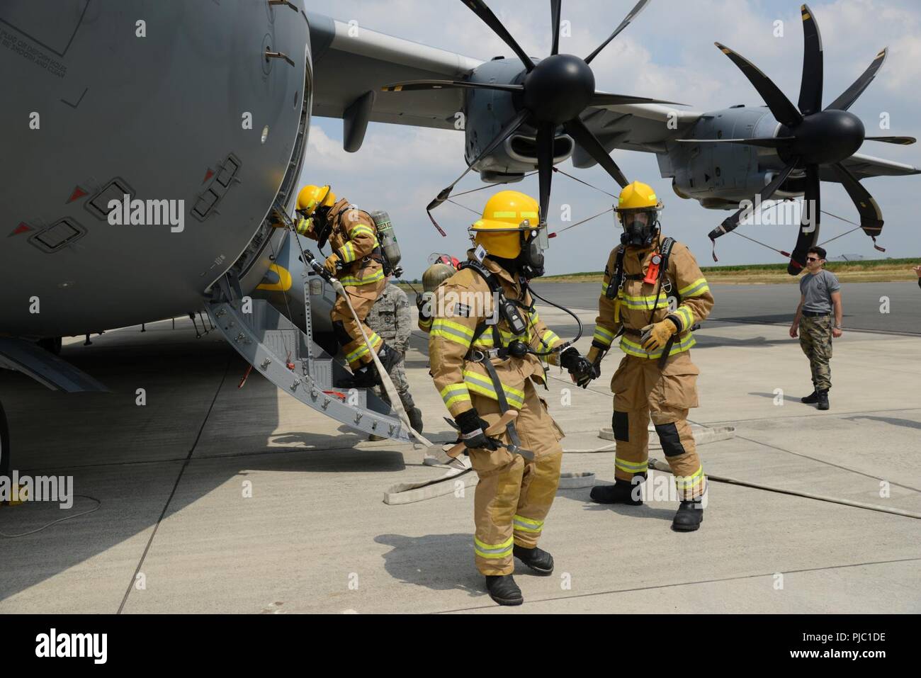 U.S. Airmen, assigned to the 424th Air Base Squadron, bring a water ...