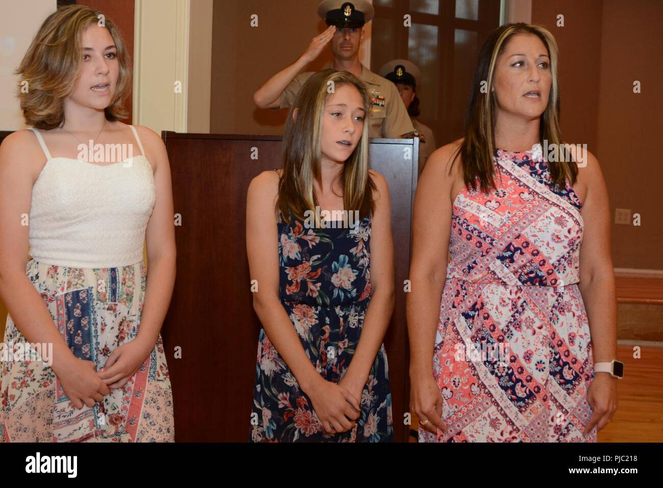 Master Chief James Baker's wife and two daughters sing the National ...