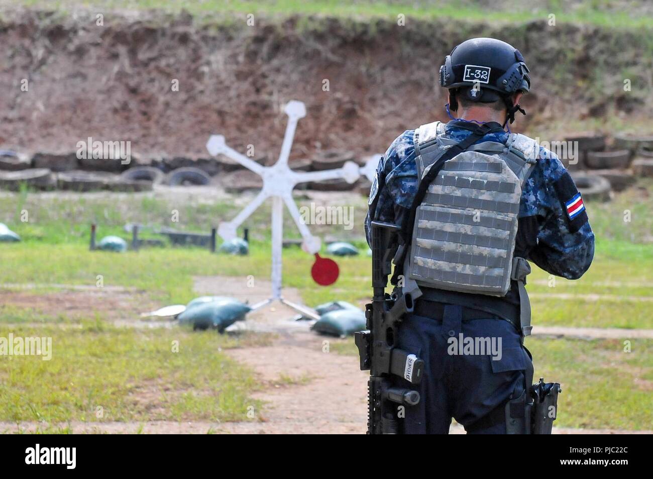 A team member with Costa Rica shoots his target in the assault event at ...