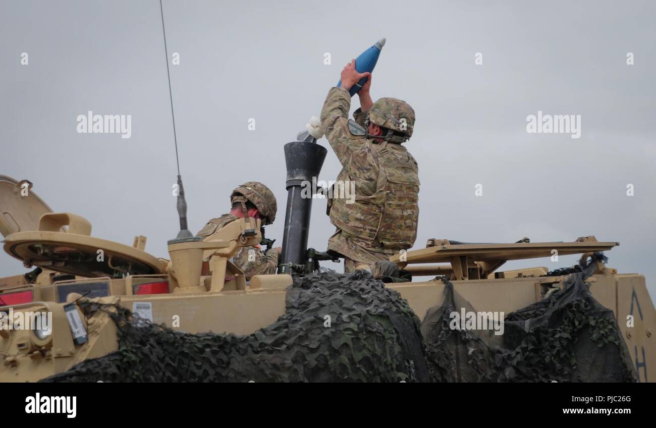 Army Pvt. 1st Class Marcus Escamilla, an assistant gunner assigned to ...