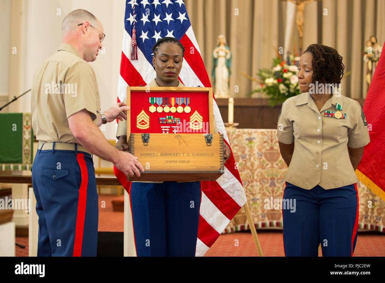 A shadow box is presented during the retirement ceremony of U.S. Marine ...