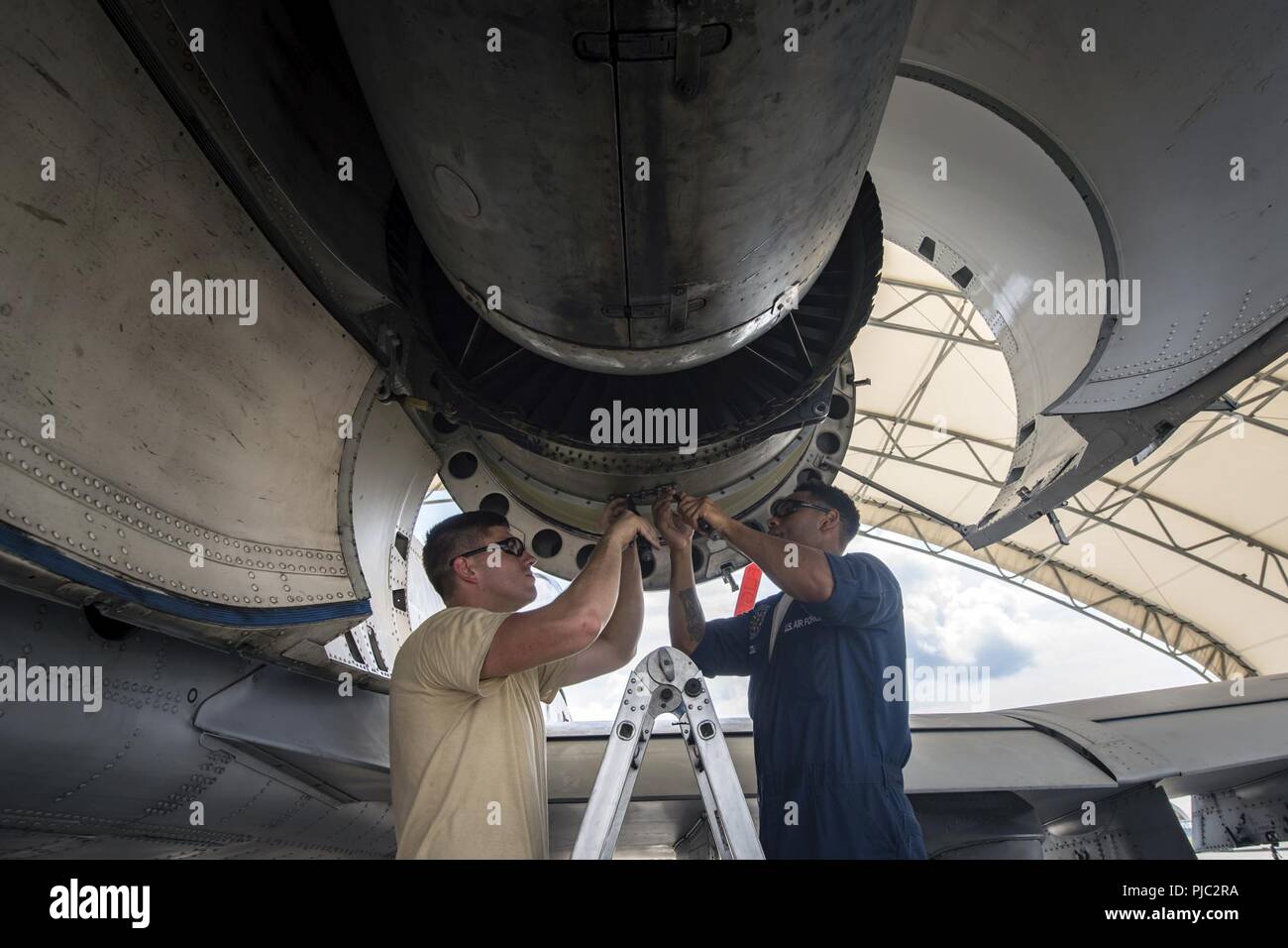 Airmen from the 74th Aircraft Maintenance Unit (AMU) repair a Turbo-Fan ...