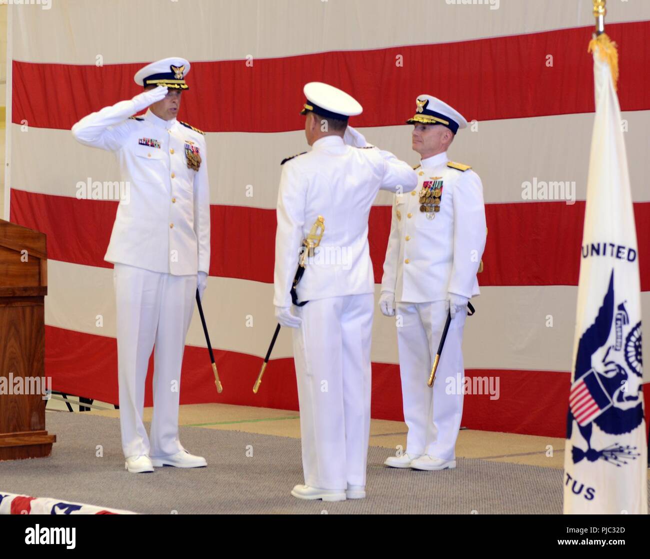 Capt. Olav Saboe salutes Capt. Michael Mullen as he relieves him as ...
