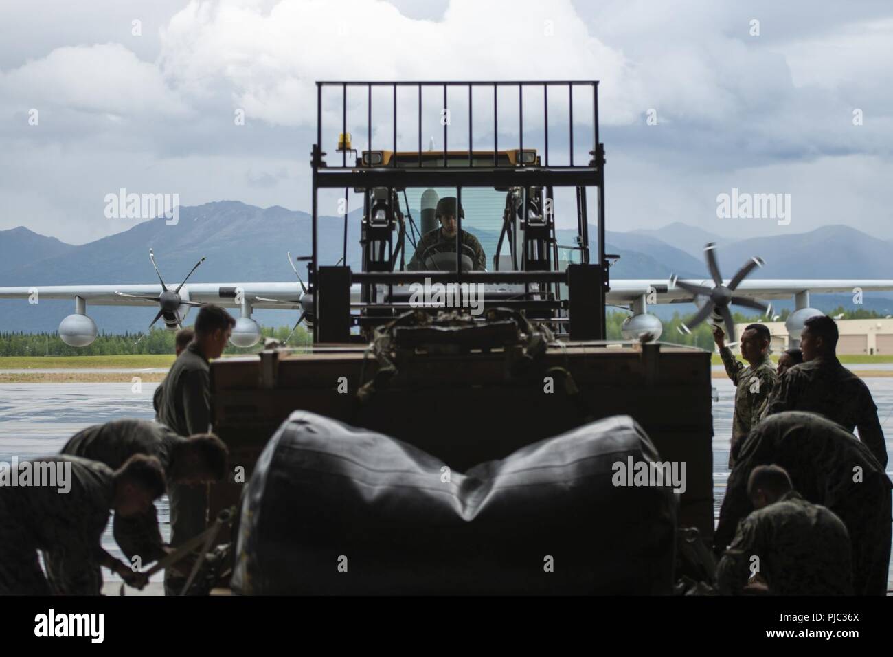 U.S. Marines with the 3d Transportation Support Battalion, secure a ...