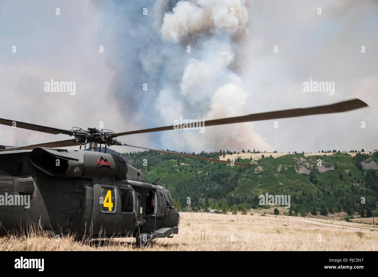 A Colorado National Guard UH-60 Black Hawk crew pauses their ...