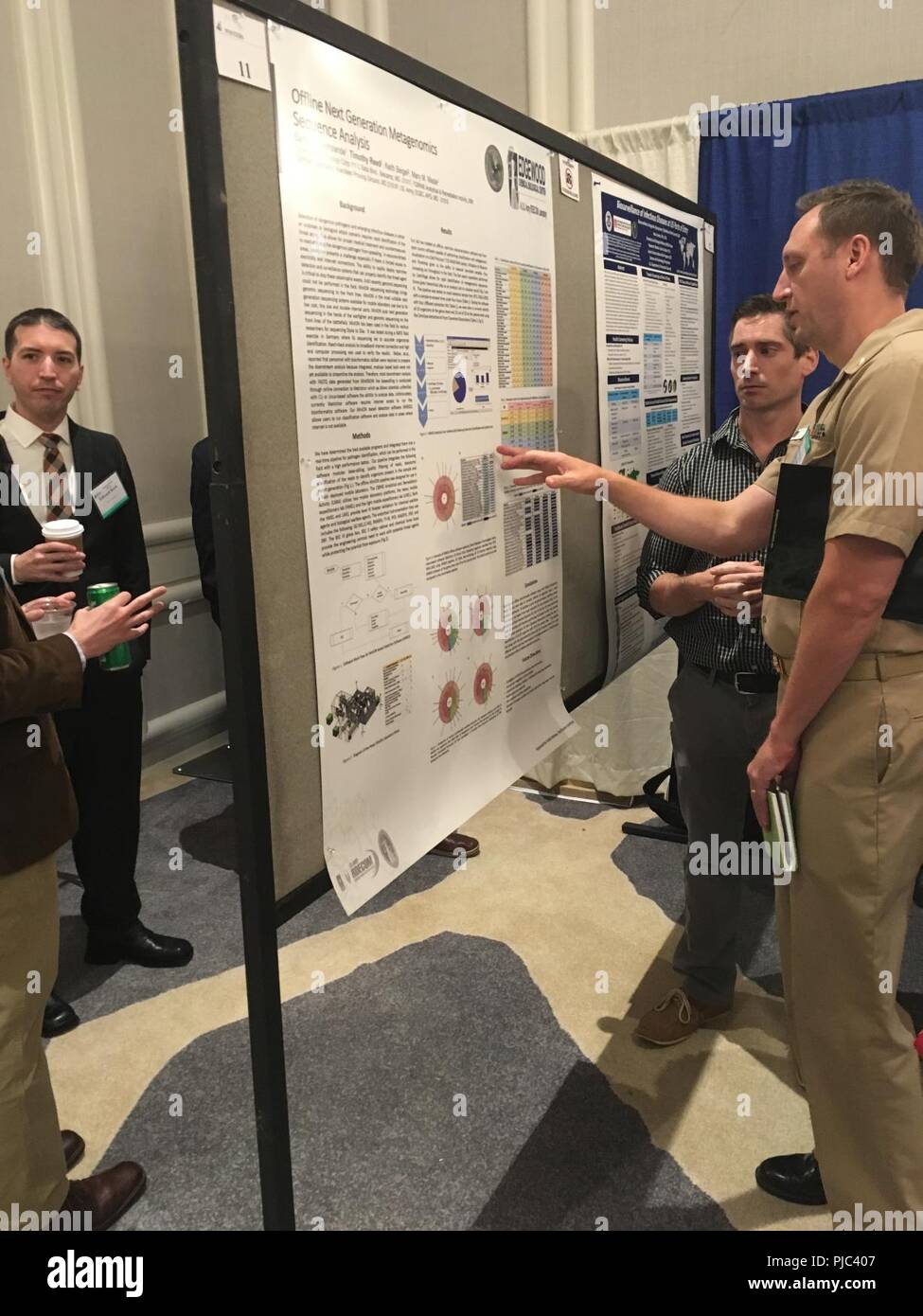 Tim Reed answers questions during his poster session at the 2018 ...