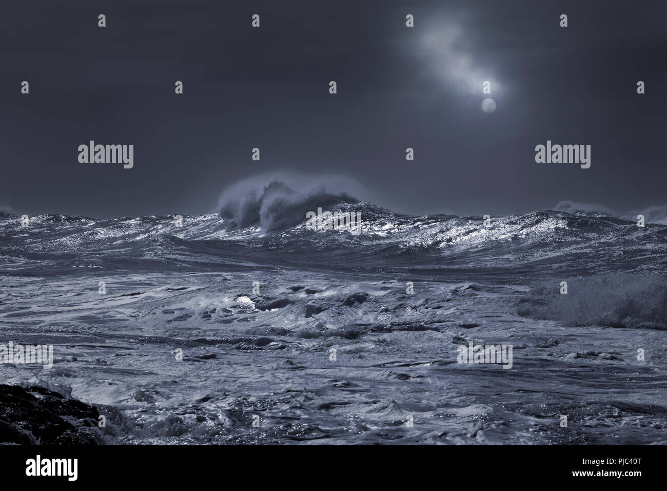 Stormy sea in an overcast and foggy full moon night Stock Photo - Alamy