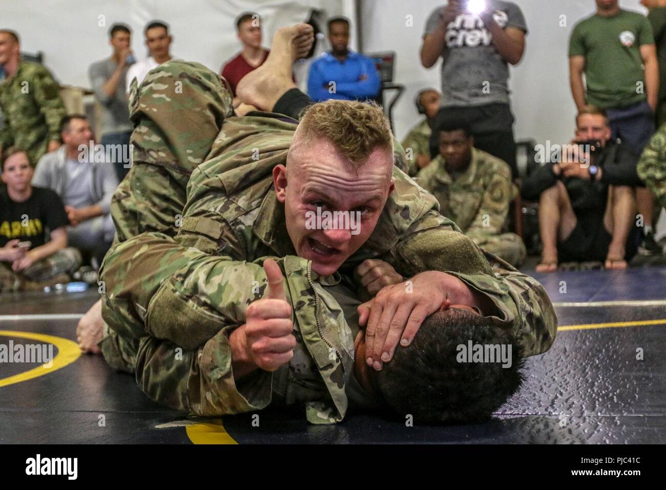 A U.S. Army Soldier with 1st Squadron, 2nd Cavalry Regiment gives a ...