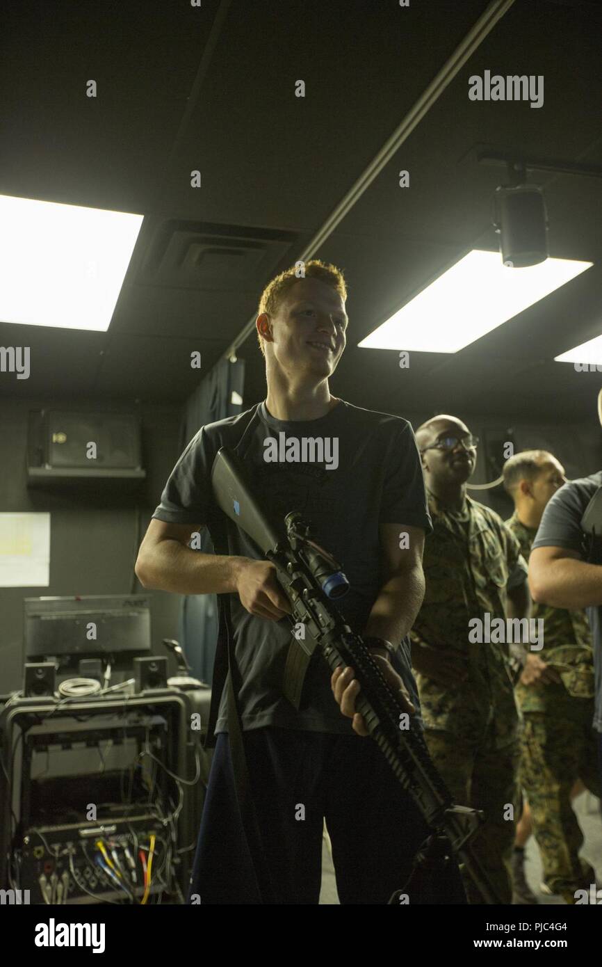 Grayson Dill points his rifle down in the Indoor Simulated Marksmanship ...