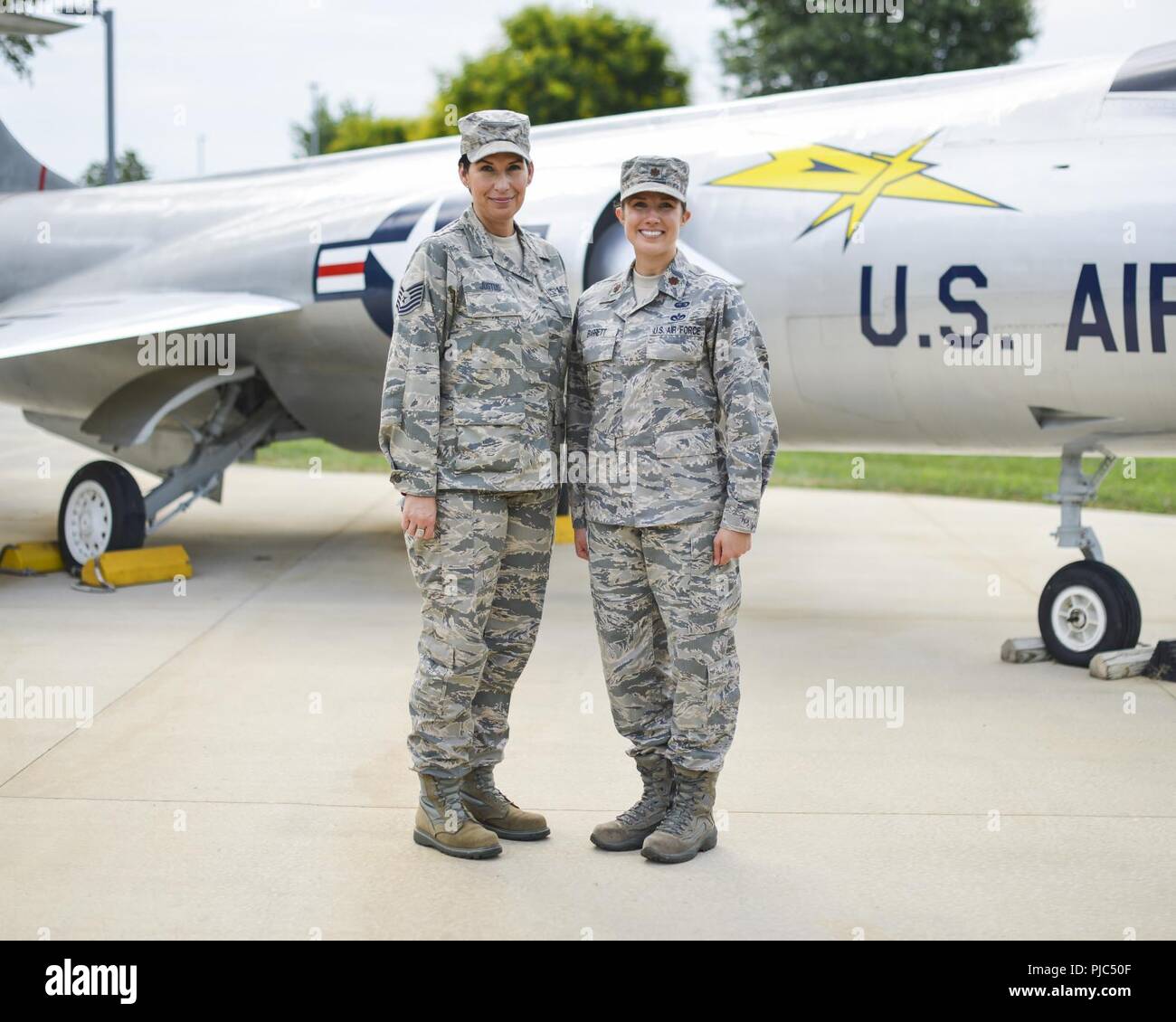 Major Tarren Barrett and Tech. Sgt. Stephanie Justus pose for the MEO ...