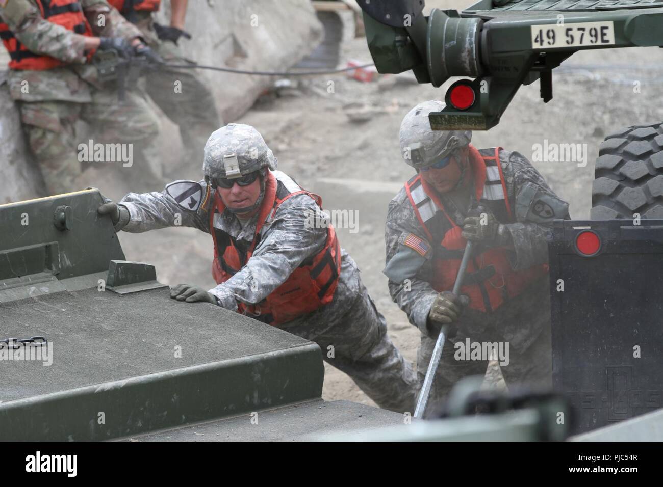 Dust and dirt fly as U.S. Army Sgt. 1st Class Hanley Ramirez and Spc ...