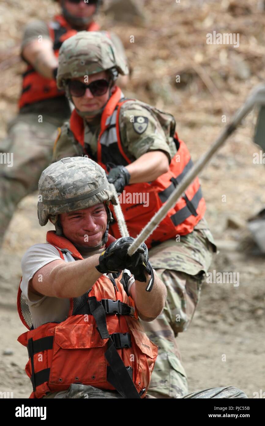 U.S. Army engineers Spc. Aaron W. Parker, Sgt. Ellie Ogsbury and Spc ...