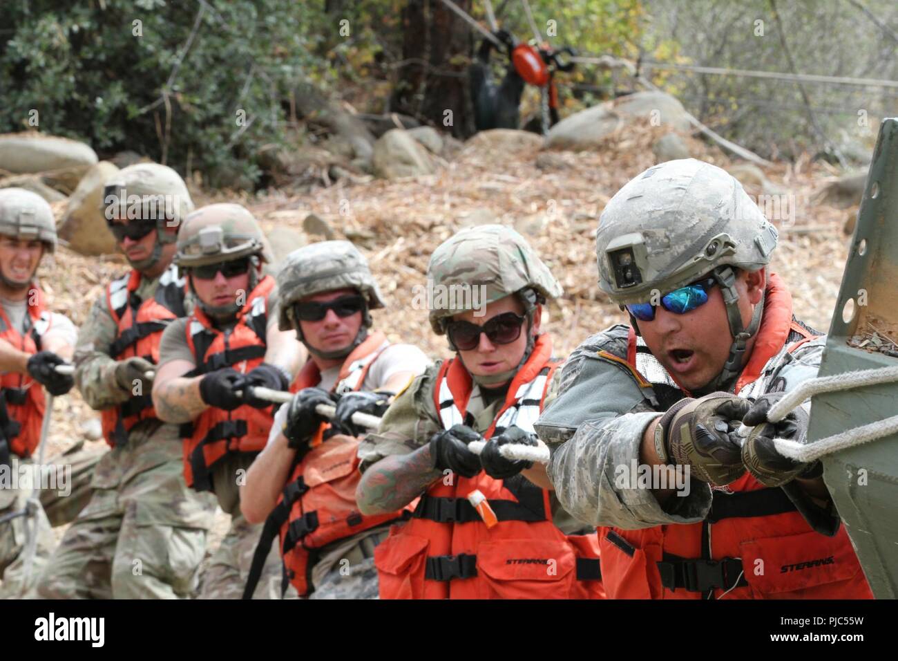 U.S. Army Spc. Jeff Mann, right, leads a squad of engineers from the ...