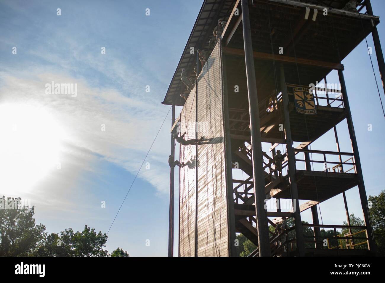 Cadets rappel down a 70-foot tower during the confidence training phase ...