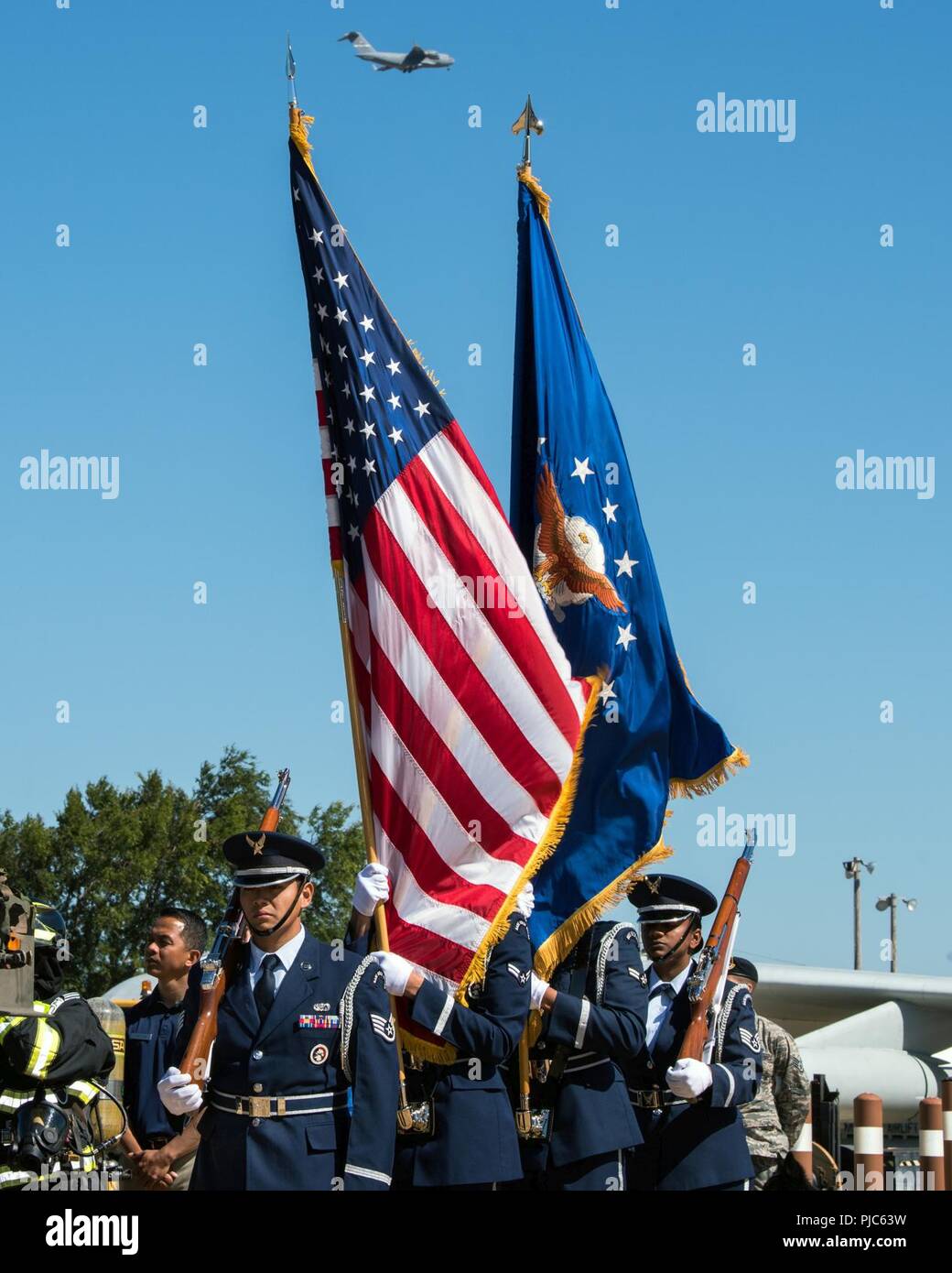Members of the honor guard prepare to present the colors prior to the ...