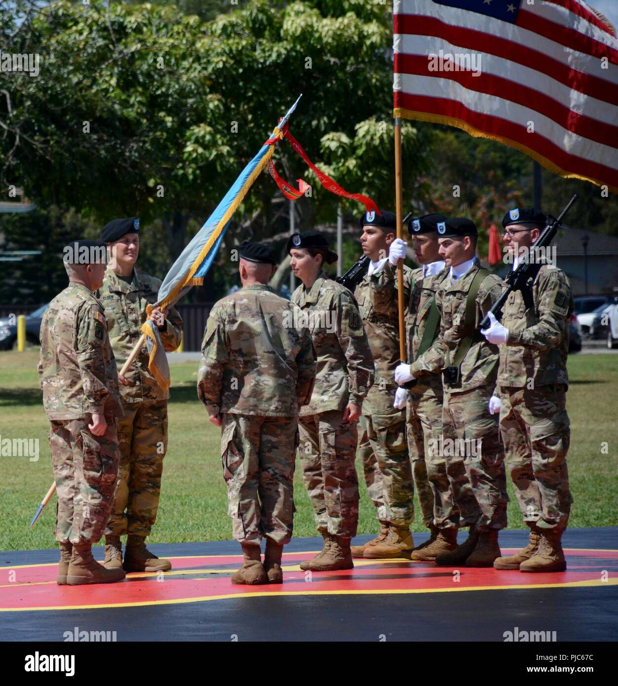 Col. David P. Elsen holds the Brigade colors as he assumes command of ...