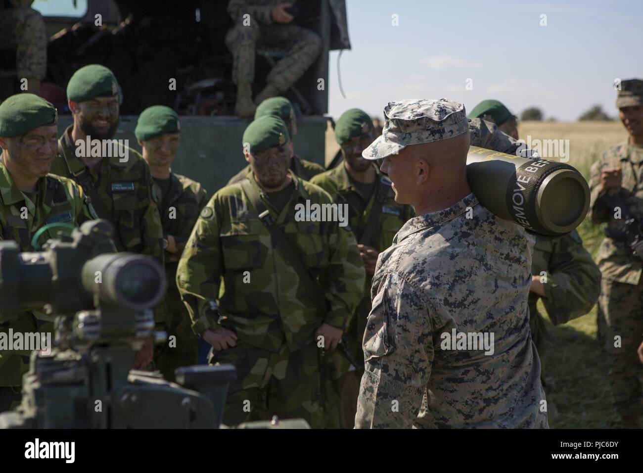 U.S. Marine Corps Sgt. James Sneed, right, assistant platoon sergeant with Echo Battery, 2nd ...
