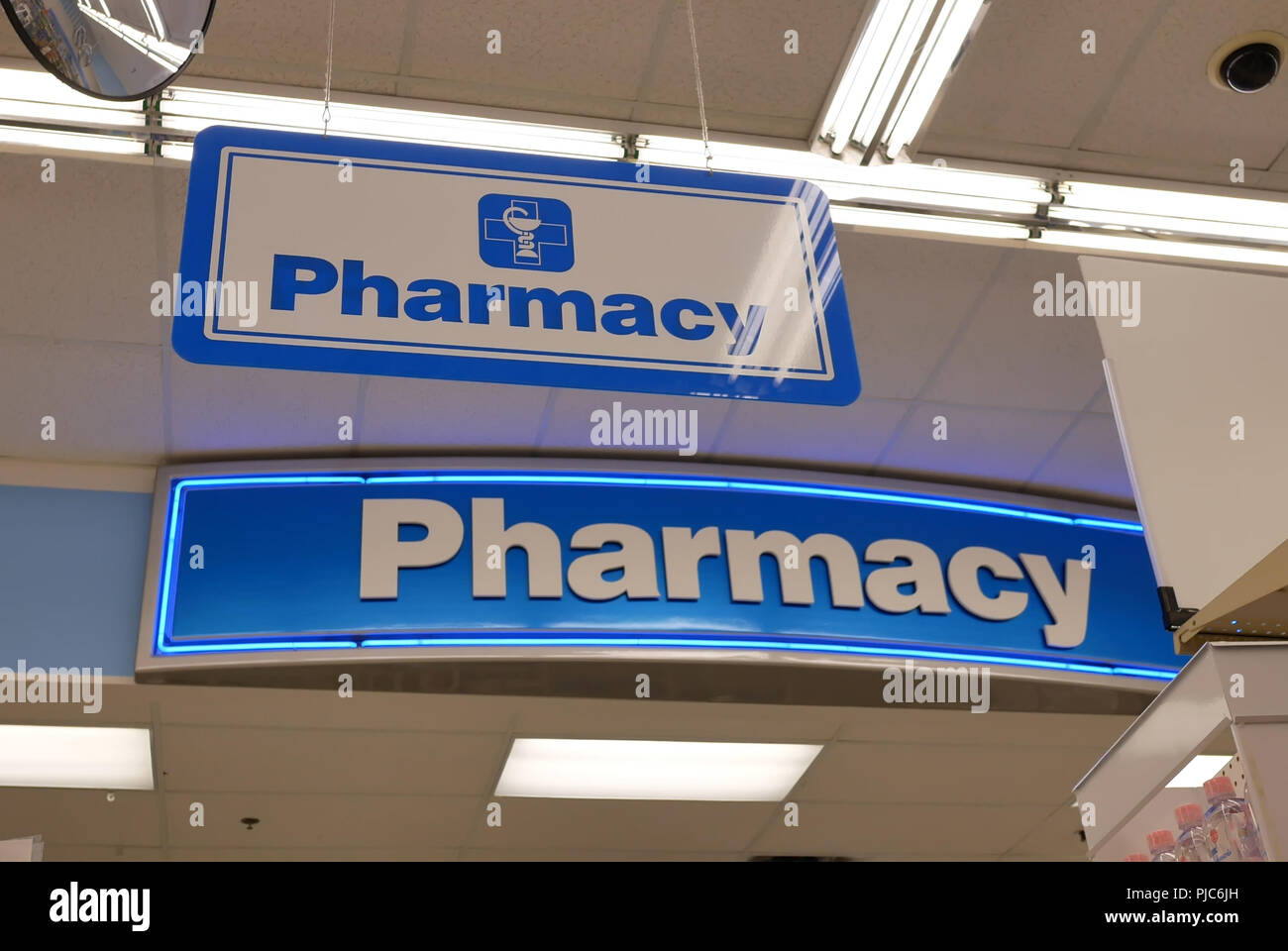 Close up of pharmacy sign hanging on store Stock Photo - Alamy