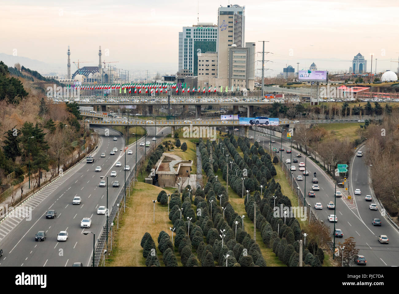 Islamic Republic of Iran. Tehran city center and mountainous background ...