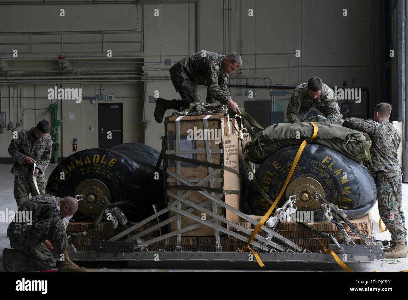 U.S. Marines with the 3d Transportation Support Battalion, secure a ...