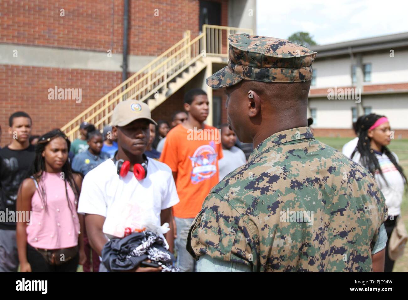 U.S. Marine Corps 1stSgt. James Williams welcomes dozens of Navy and ...