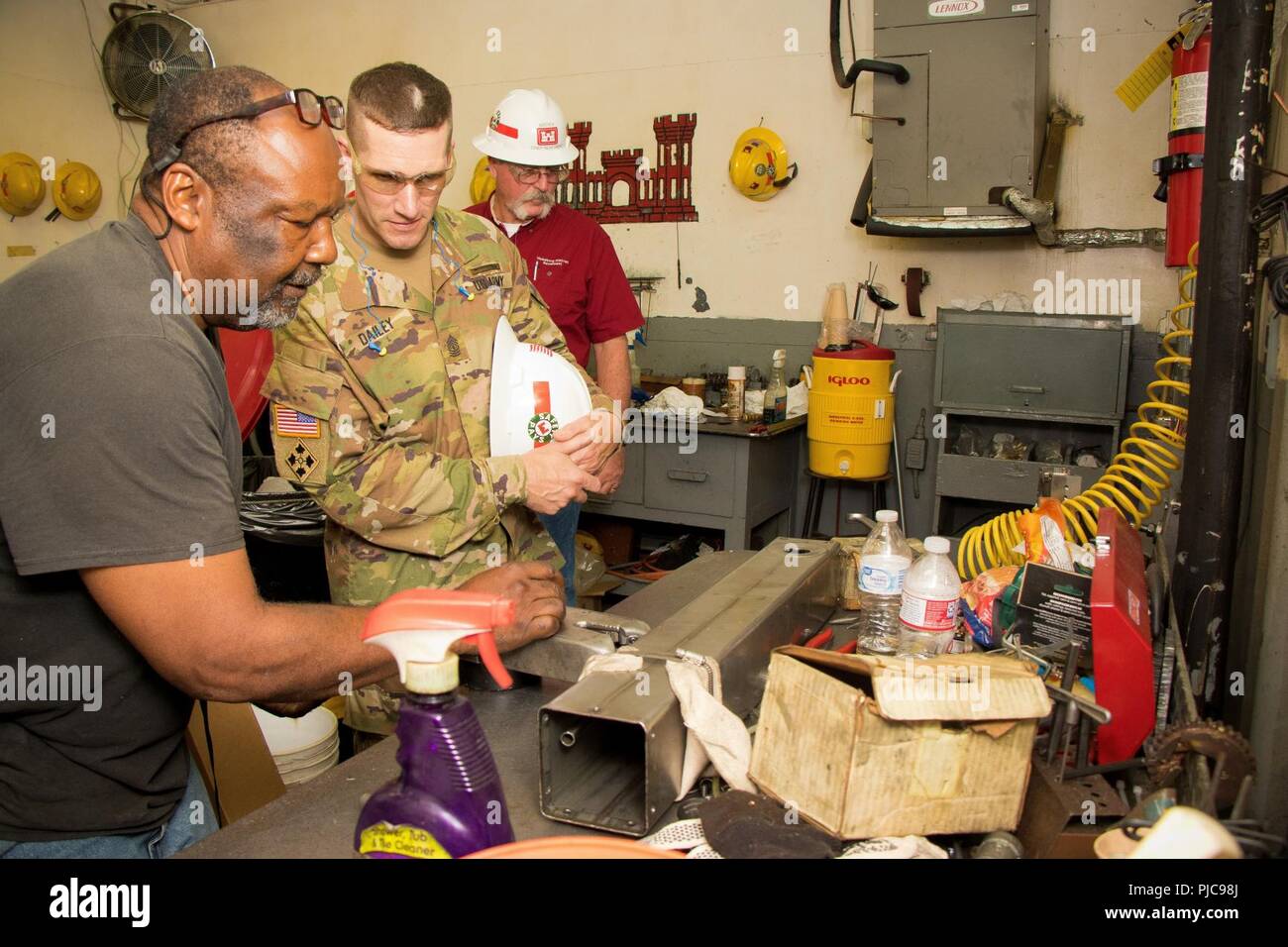 Sergeant Major of the U.S. Army Daniel Dailey observes an employee ...