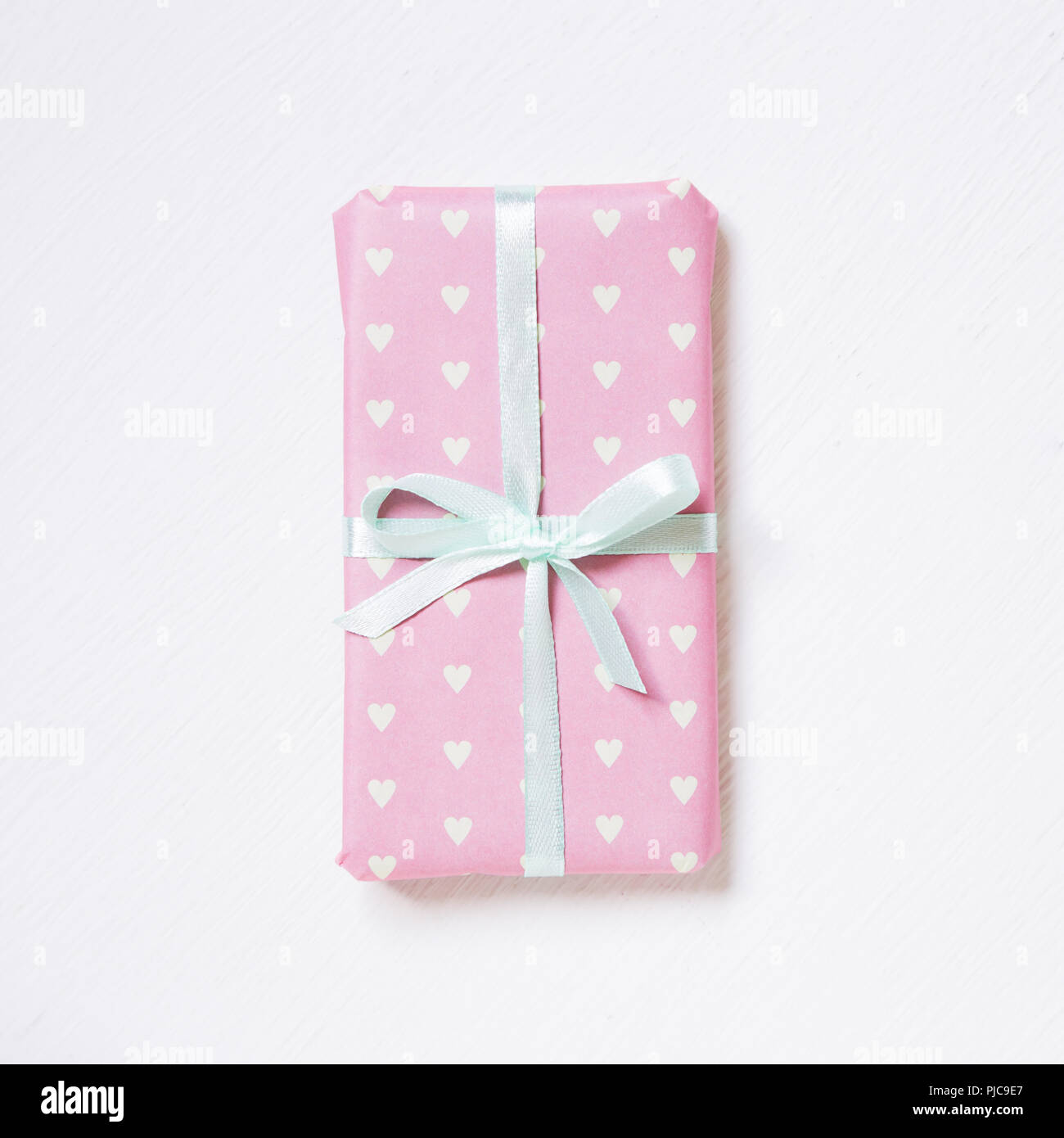 Pink color heart shape pattern gift box on white background Stock Photo ...