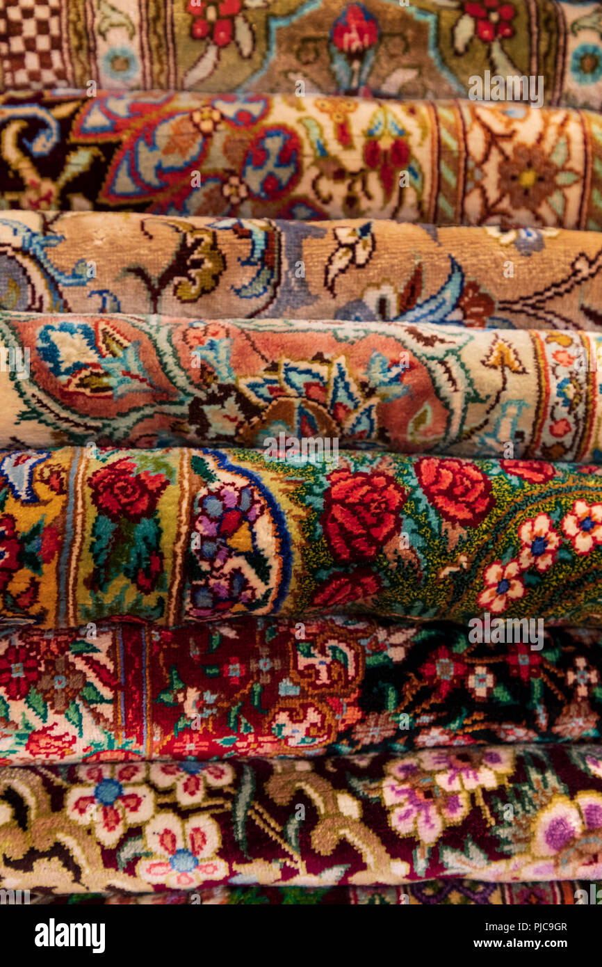 Islamic Republic of Iran. Isfahan. Carpet sales shop. Stacked carpets ...