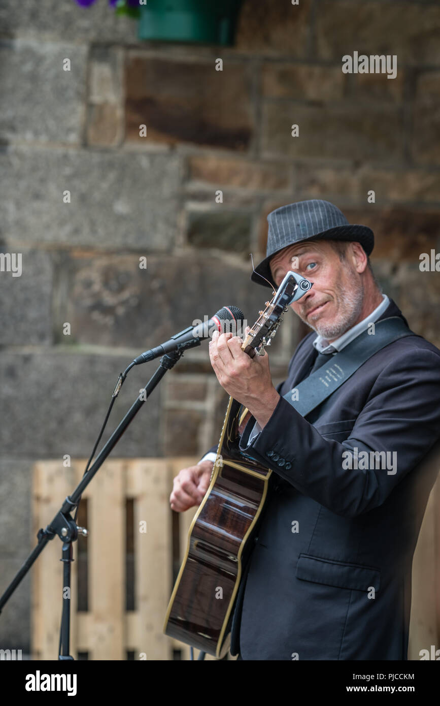 Penzance, England - May 2018 : Street busker playing acoustic guitar ...