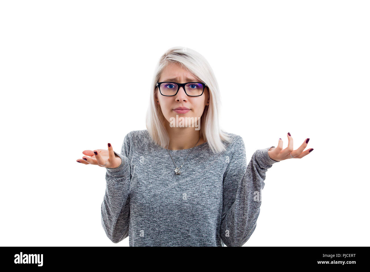 Confused woman wearing glasses and frustrated hand gesture isolated on ...