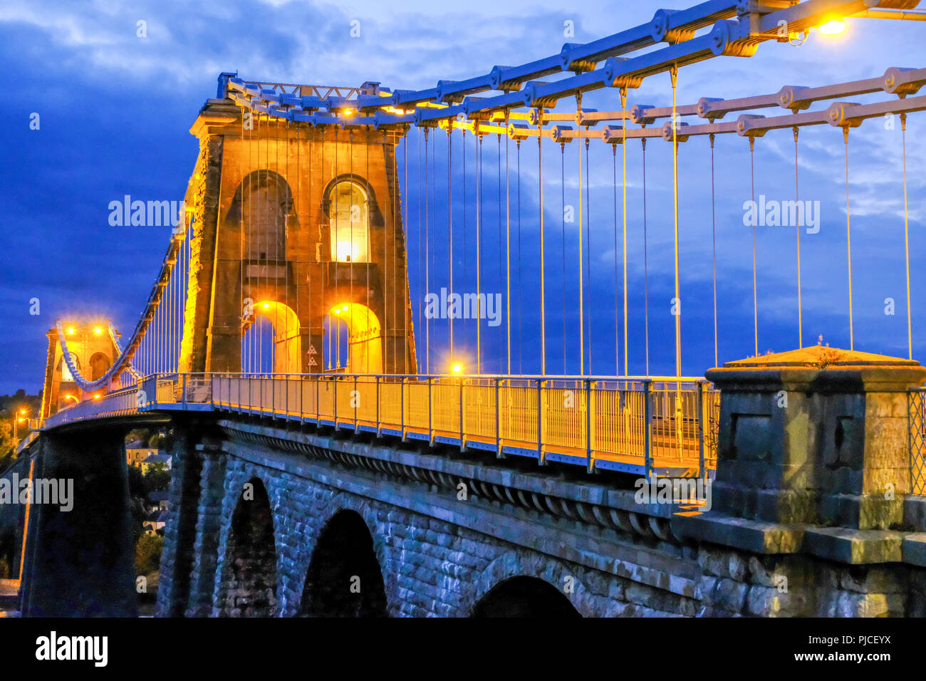 Menai Bridge Floodlit at Night Stock Photo - Alamy