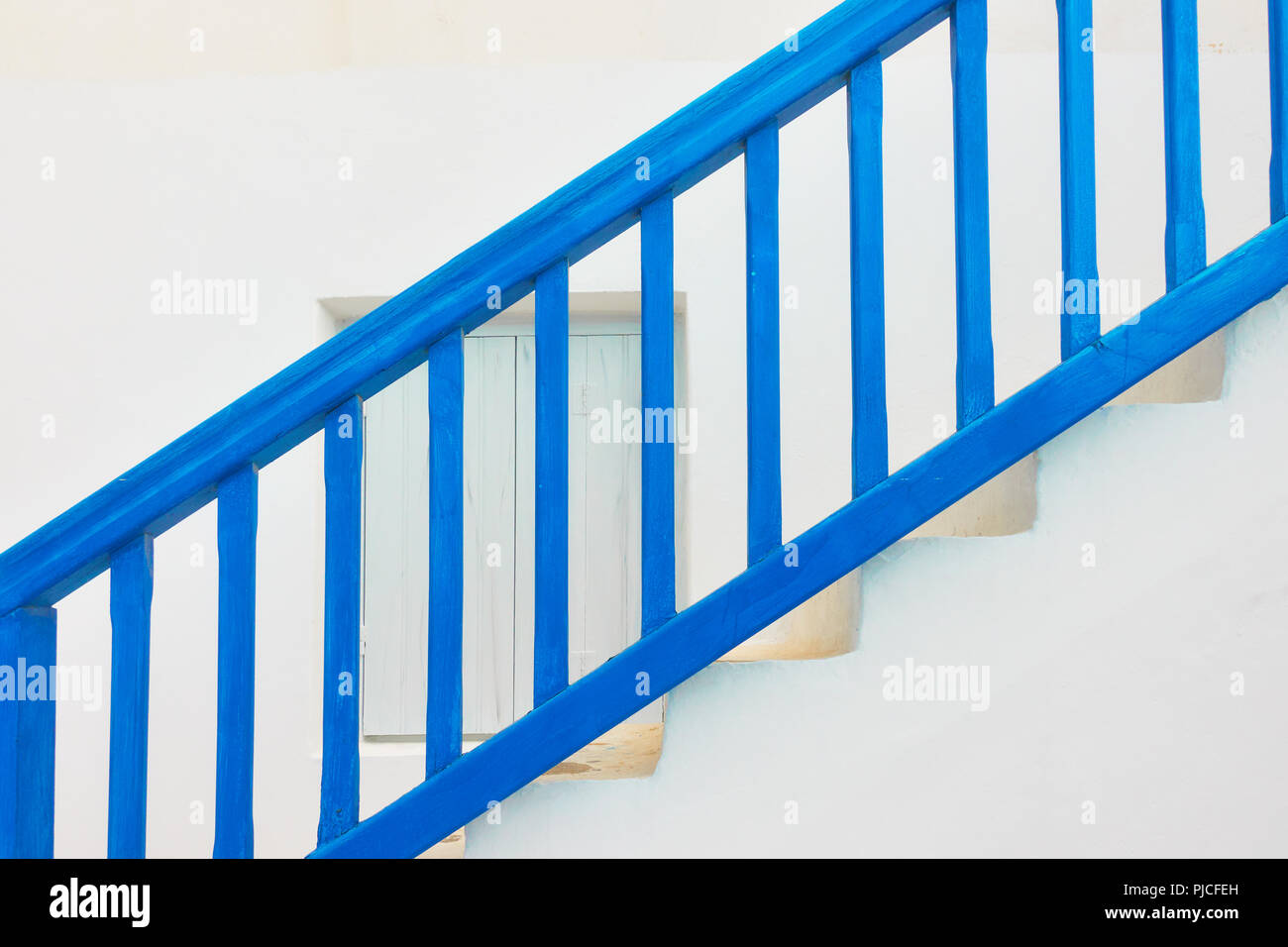 Traditional blue staircase with wooden railing in Myconos Island ...