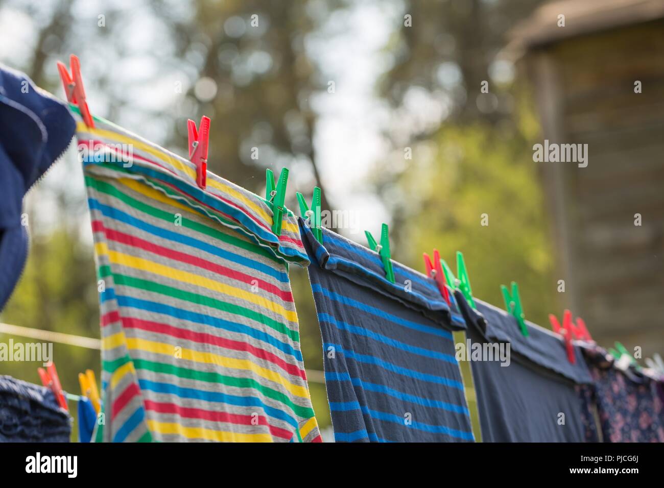 Washing line with drying clothes in outdoor. Clothes hanging on washing ...