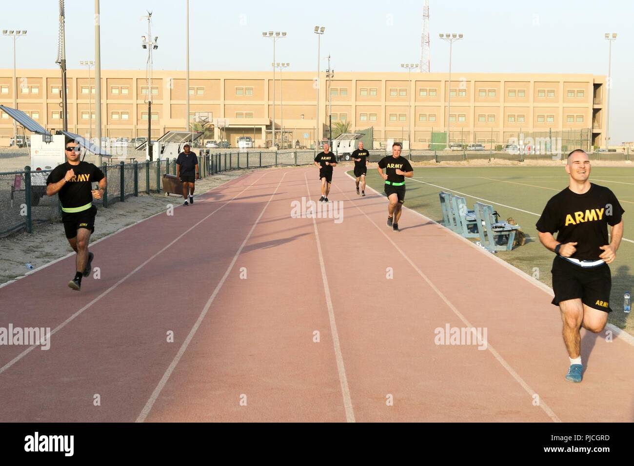CAMP ARIFJAN, Kuwait – Cpt. Corey Clark (right), with Headquarters and ...