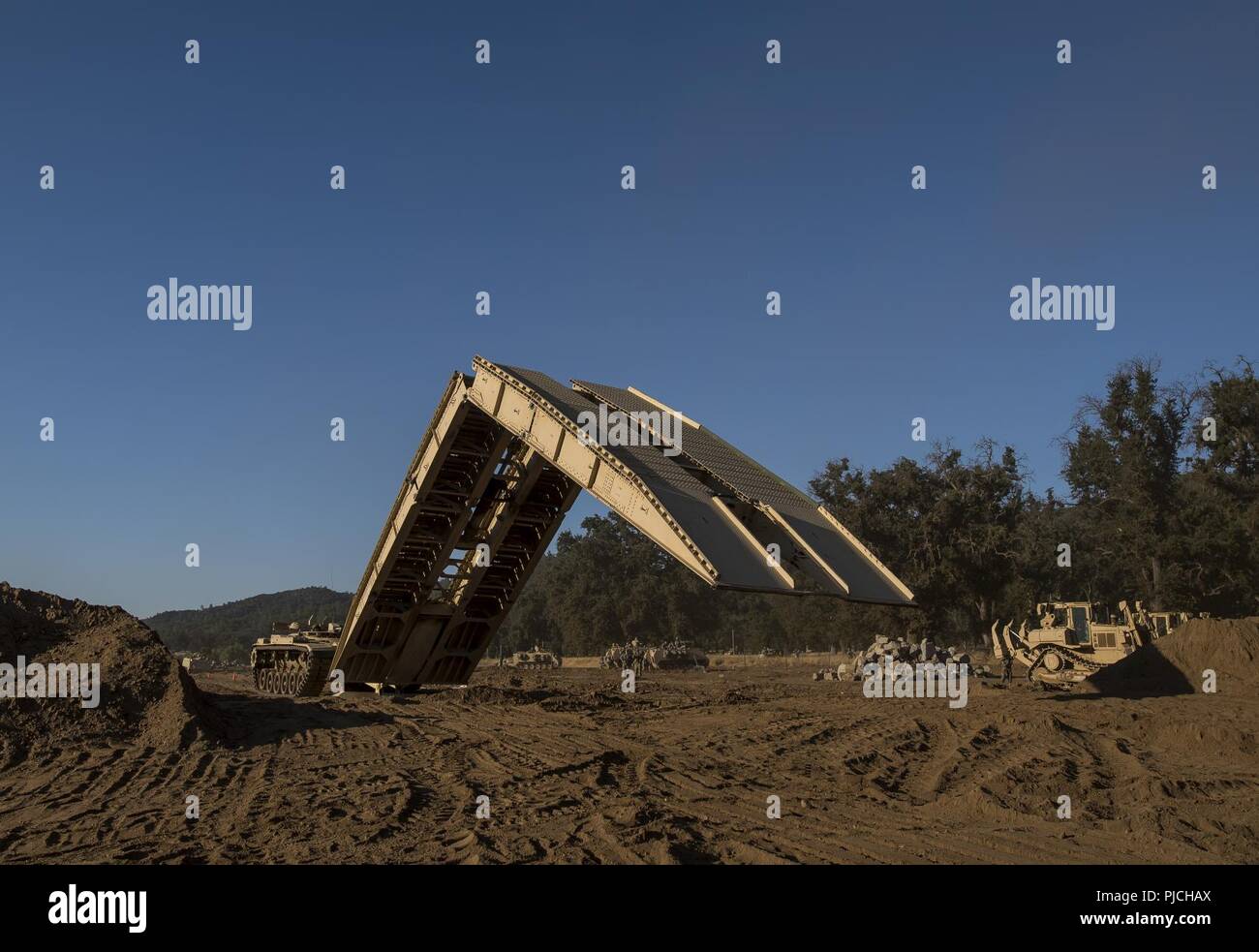 U.S. Army Reserve combat engineer Soldiers use an M60 Armored Vehicle ...