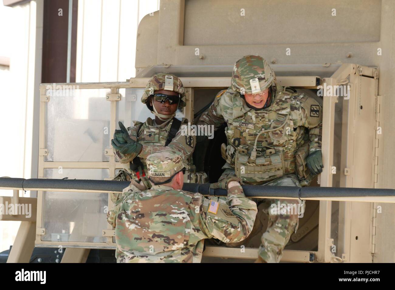 Warrant Officer Christopher Gatny of HHC 201st RSG exits the cabin of a ...