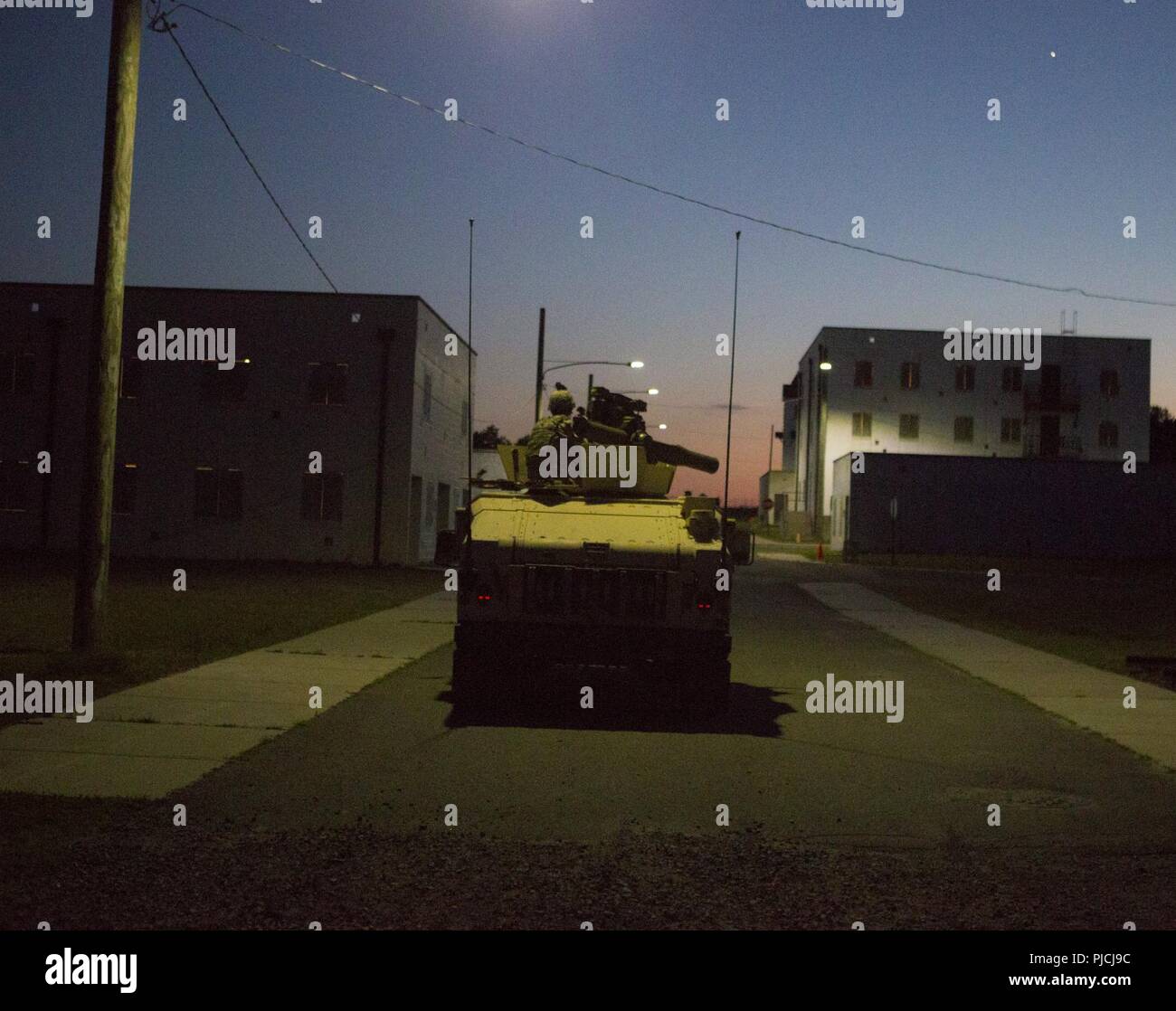A Humvee rolls into an urban warfare training area to begin a a night ...