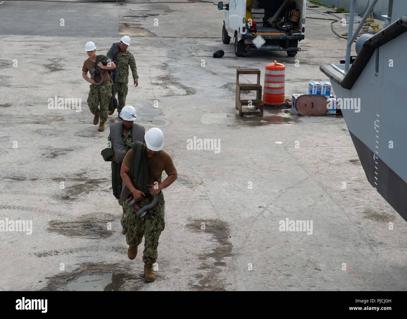 Sailors assigned to Coastal Riverine Group (CRG) 1 Det. Guam, bring ...