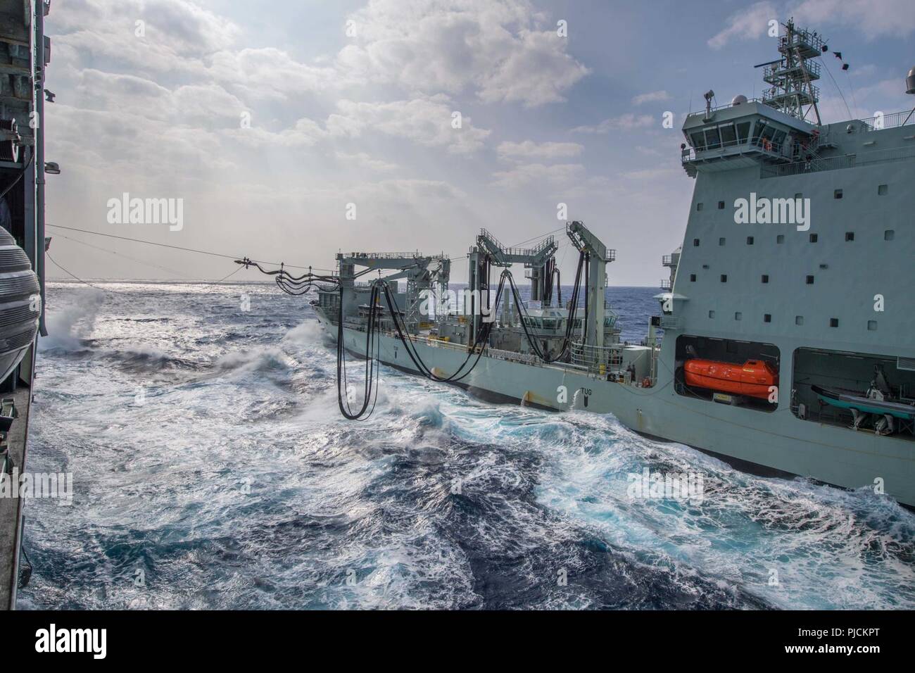 AT SEA (July 19, 2018) The landing helicopter dock ship HMAS Adelaide ...