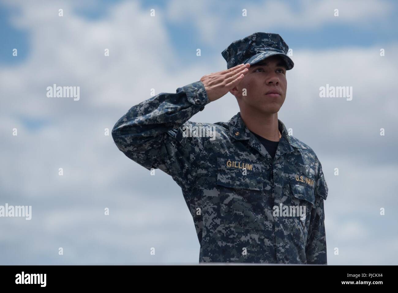 JOINT BASE PEARL HARBOR, Hawaii (July 20, 2018) – a Midshipman salutes ...
