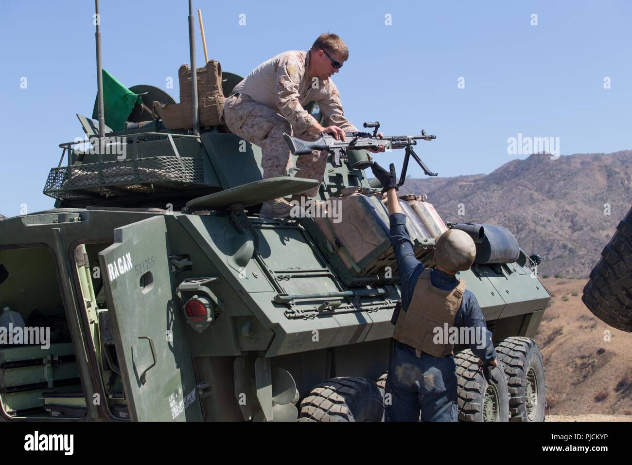 U.S. Marine Corps Staff Sgt. Daniel Ragan, top, unit leader, Light ...
